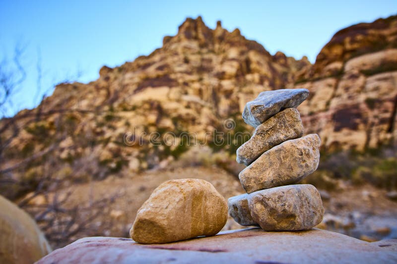 Balanced Rock Cairn with Desert Cliffs Low-Angle View Stock Photo ...