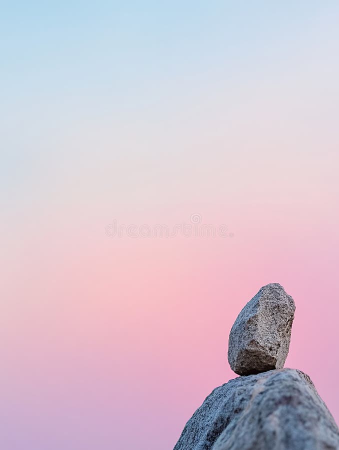A Balanced Rock Formation with a Pink and Blue Gradient Sky in the ...