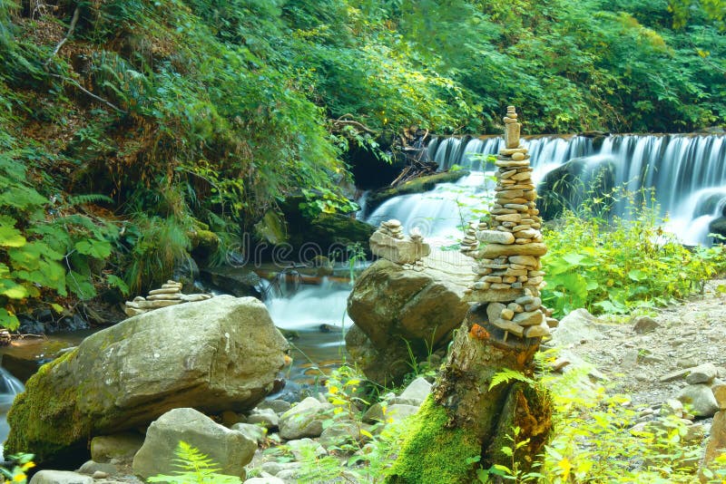 Balanced Rock Zen Stack in Front of Waterfall Stock Image - Image of ...