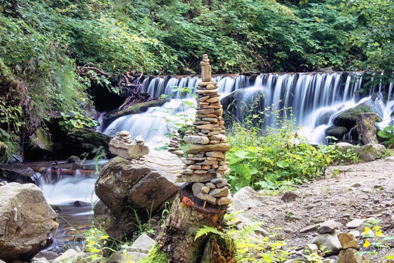 Balanced Rock Zen Stack in Front of Waterfall Stock Image - Image of ...