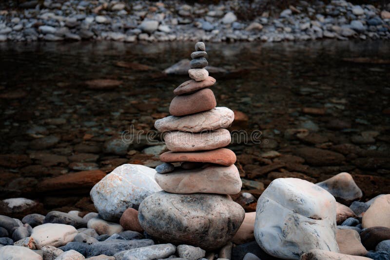 A Balanced Stack of Smooth River Rocks Stock Photo - Image of flow ...