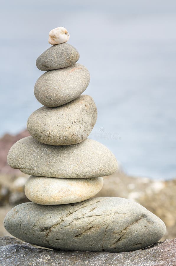 Pile of Balanced Stone on a Deserted Beach Stock Photo - Image of close ...