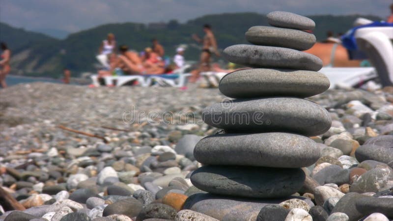 Balanced Stones Stack on Pebble Beach, Defocused Stock Video - Video of symbol, ocean: 321187597