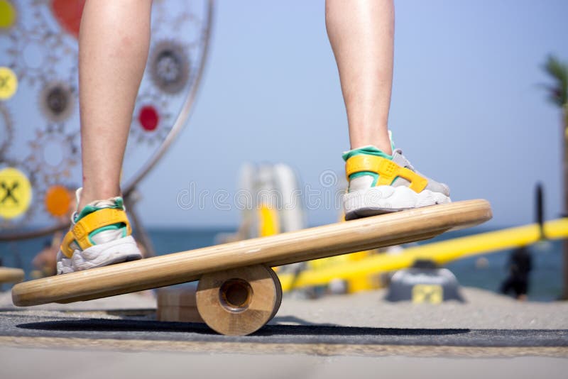 Balancing on a Balance Board in Sunny Weather at the Beach Stock Image ...