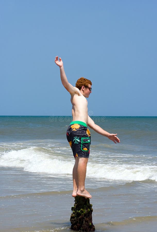Balancing on the Beach stock photo. Image of ocean, blue - 10513936