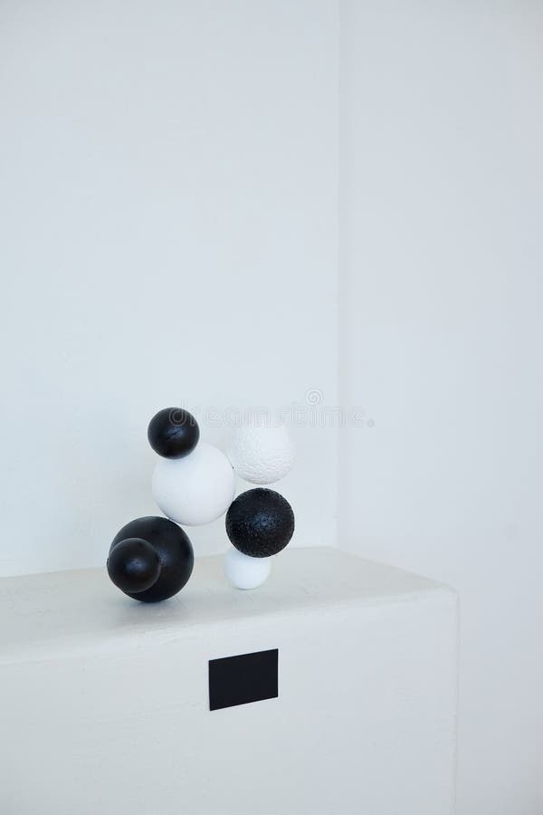 Balancing Black and White Egg-Shaped Objects on Surface Stock Image ...