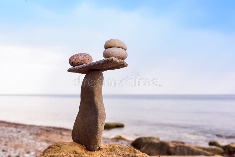 Balancing a few pebbles stock image. Image of ocean, evening - 79170799