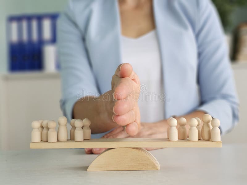 Balancing Figures on a Scale with a Hand Symbolizing Guidance and ...