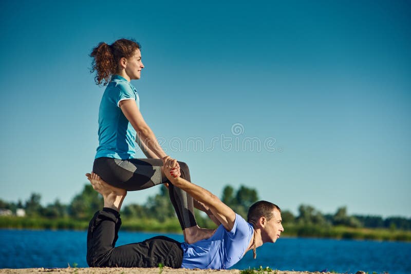 Balancing in pair stock image. Image of exercise, pose - 90980545