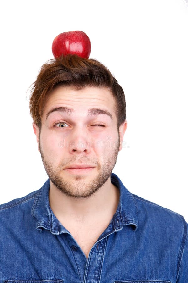 Balancing Red Apple on Head Stock Image - Image of confidence, face ...