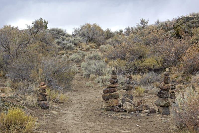 Balancing Rock Stacking on Trail in Desert Stock Image - Image of lava ...