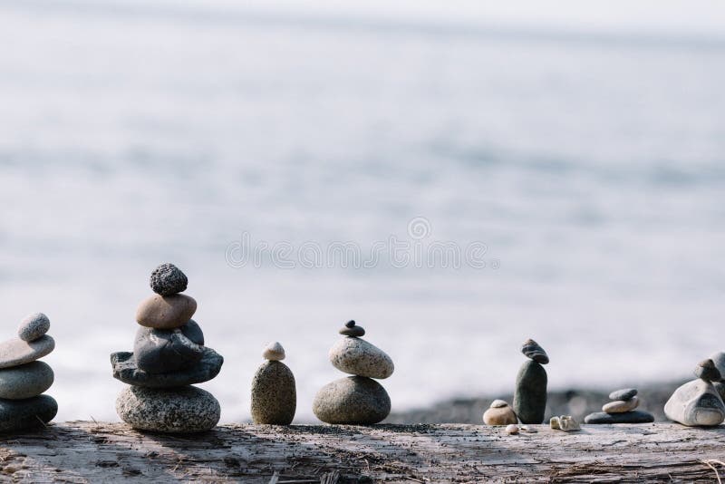 Balancing Rocks on Each Other at the Beach Stock Photo - Image of ...