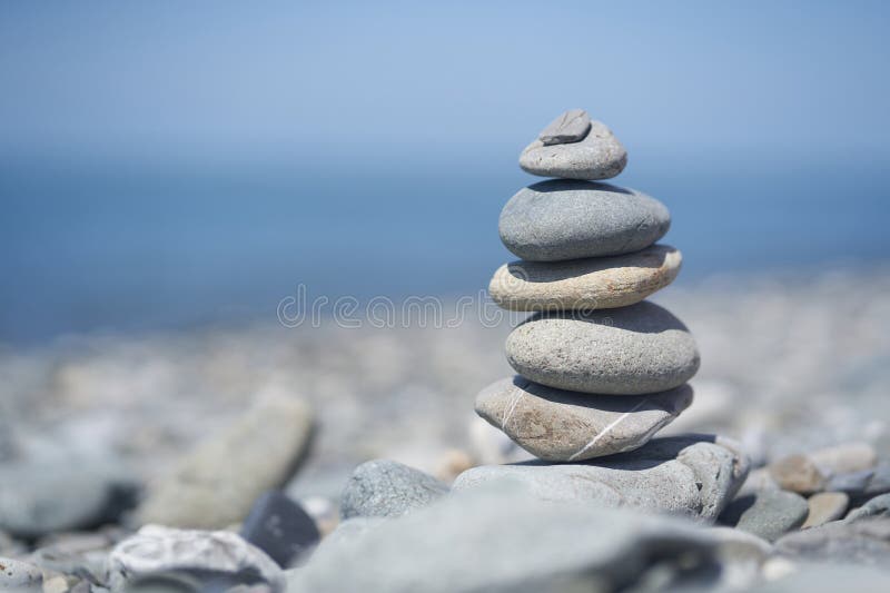 Balancing Rocks on a Pebble Beach during Sunset. Smooth Pebbles on the ...