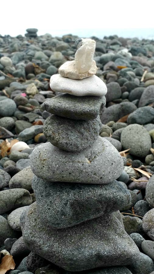 Balancing Stones in the Beach Stock Photo - Image of stonewall, stones ...