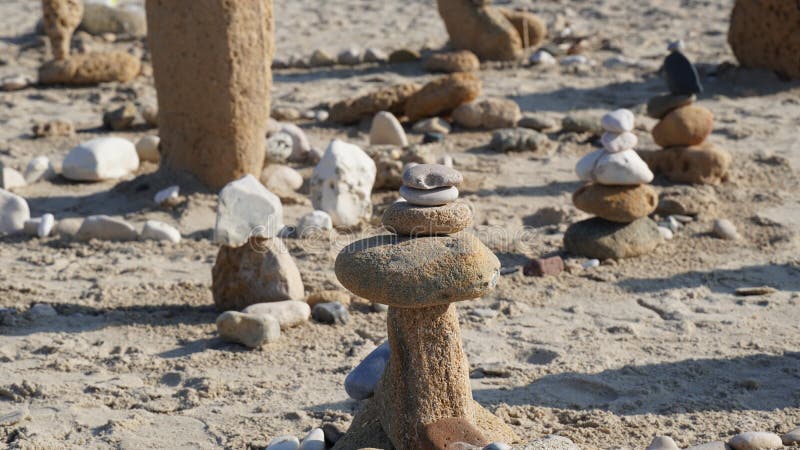 Balancing Stones on Sand. Zen Style Stones by the Sea Stock Image ...