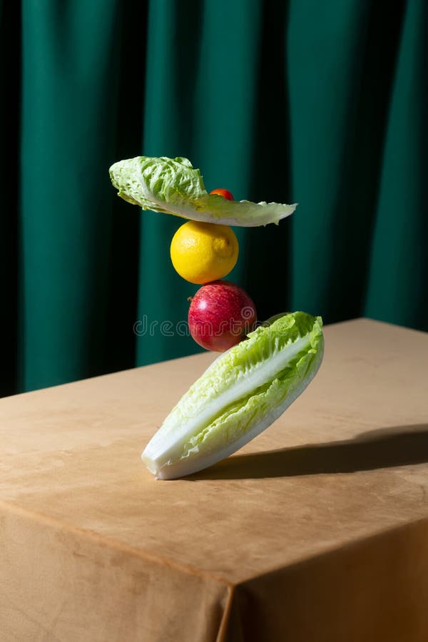 Balancing Vegetables and Fruits, Creative Concept, Vertical Stock Photo ...