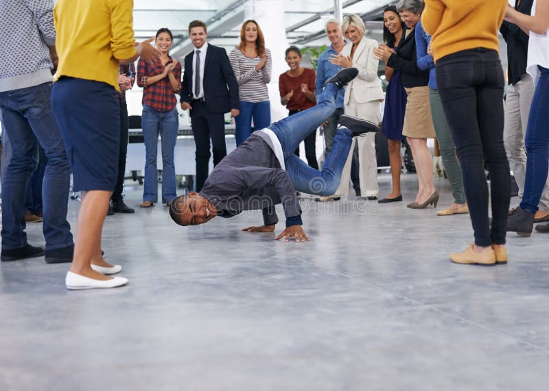 Balancing Work and Play. a Man Breakdancing in an Office Full of ...