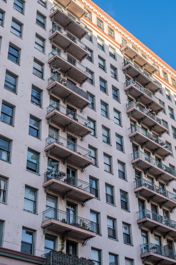 Balconies on Pink Condos stock image. Image of condominiums - 249335793