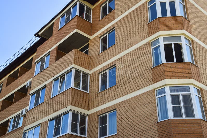 Balconies and Windows of a Multi-storey New House. New House of Brick ...