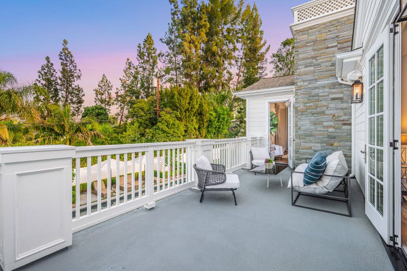 Balcony Adorned with Multiple Chairs in a New Construction Home in ...