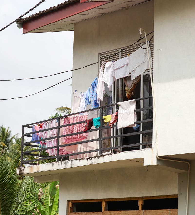 A Balcony with Clothes Hanging on a Line Stock Photo - Image of clothes ...