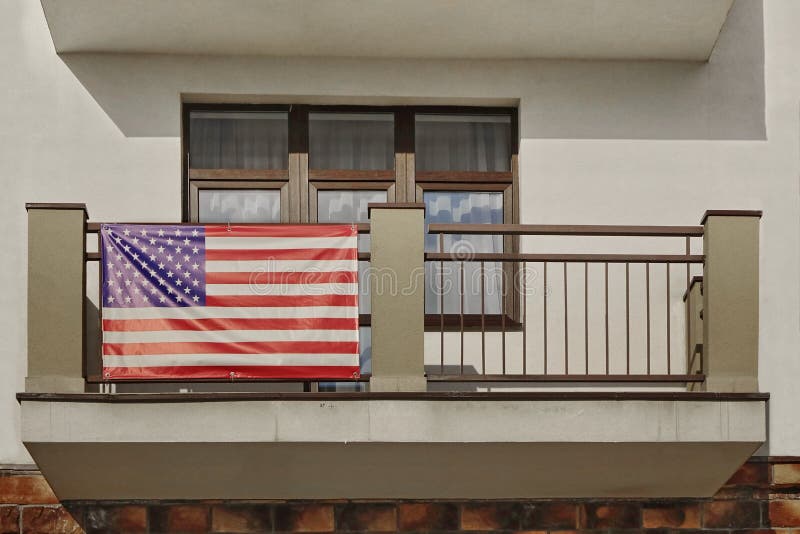 Balcony with Hanging American Flag on the Handrail Stock Photo - Image ...