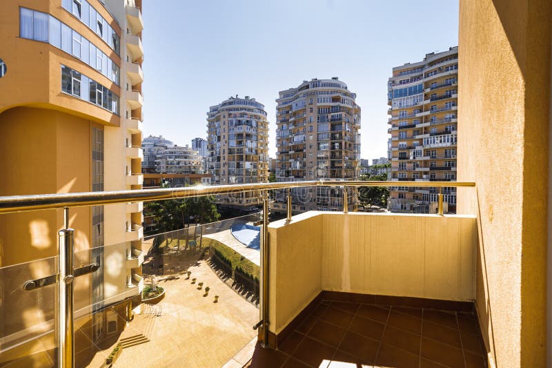 A Balcony Overlooking a City with a View of a Pool Stock Image - Image ...