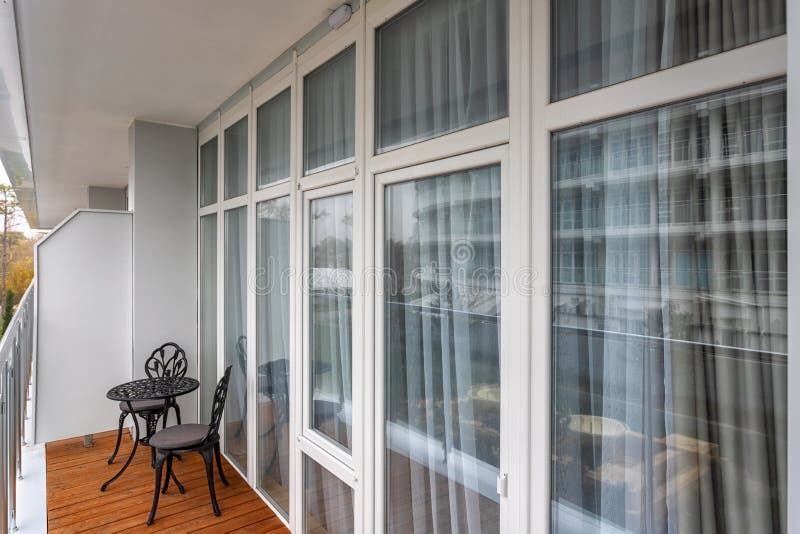 Balcony with Table and Chairs in the Hotel with Panoramic Windows Stock ...