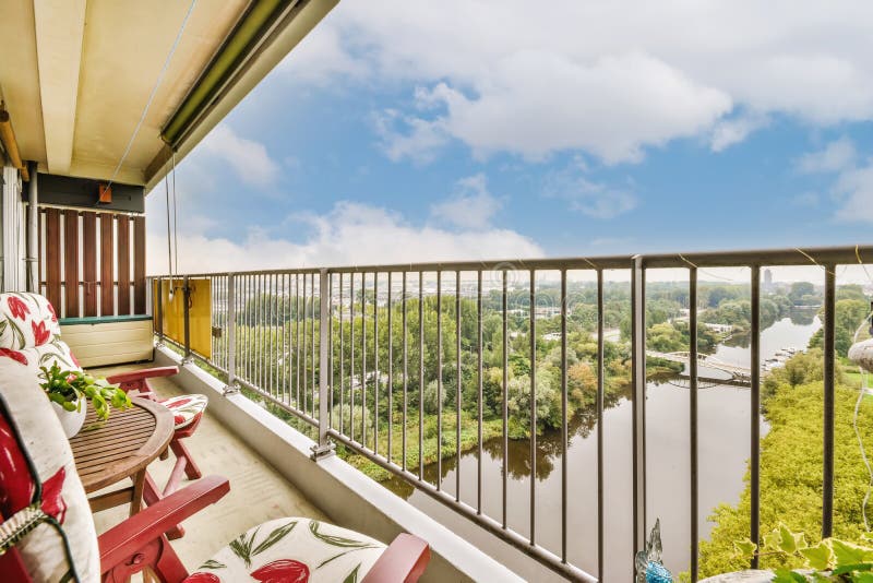 A Balcony with a View of a River and Trees Stock Image - Image of ...