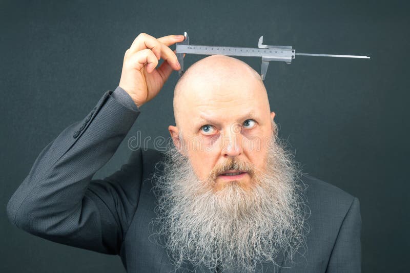 Bald Bearded Man Measures the Width of His Head with a Caliper Stock ...