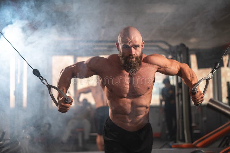Bald Caucasian Bodybuilder Training Chest Using Cable Crossover in Gym ...