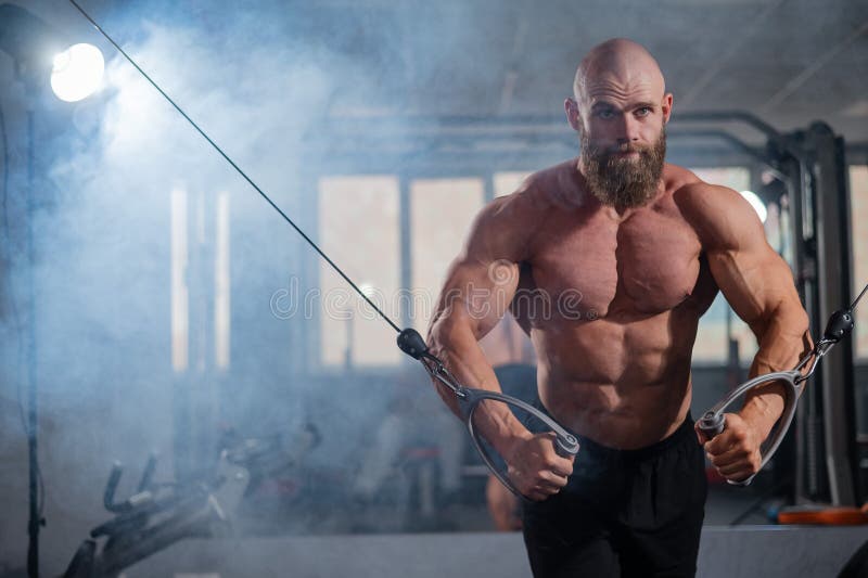 Bald Caucasian Bodybuilder Training Chest Using Cable Crossover in Gym ...