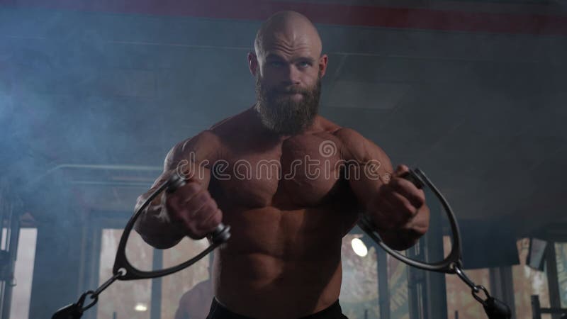 Bald Caucasian Bodybuilder Training Chest Using Cable Crossover in Gym ...
