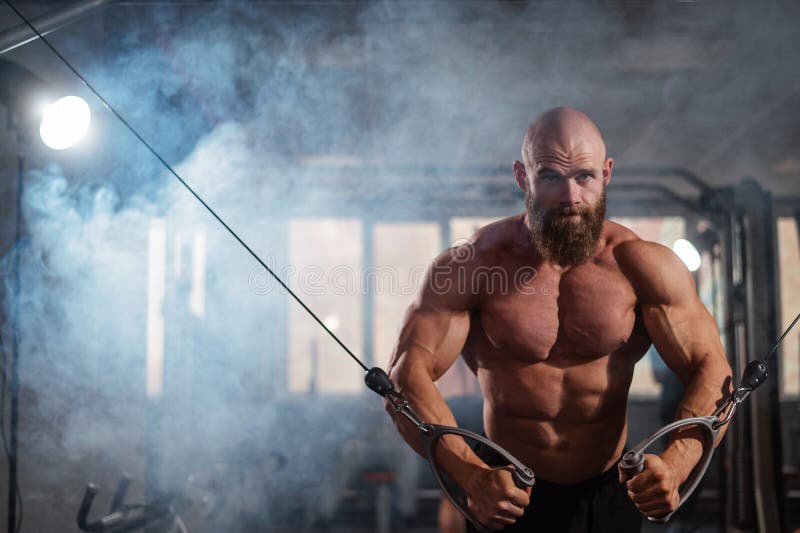 Bald Caucasian Bodybuilder Training Chest Using Cable Crossover in Gym ...