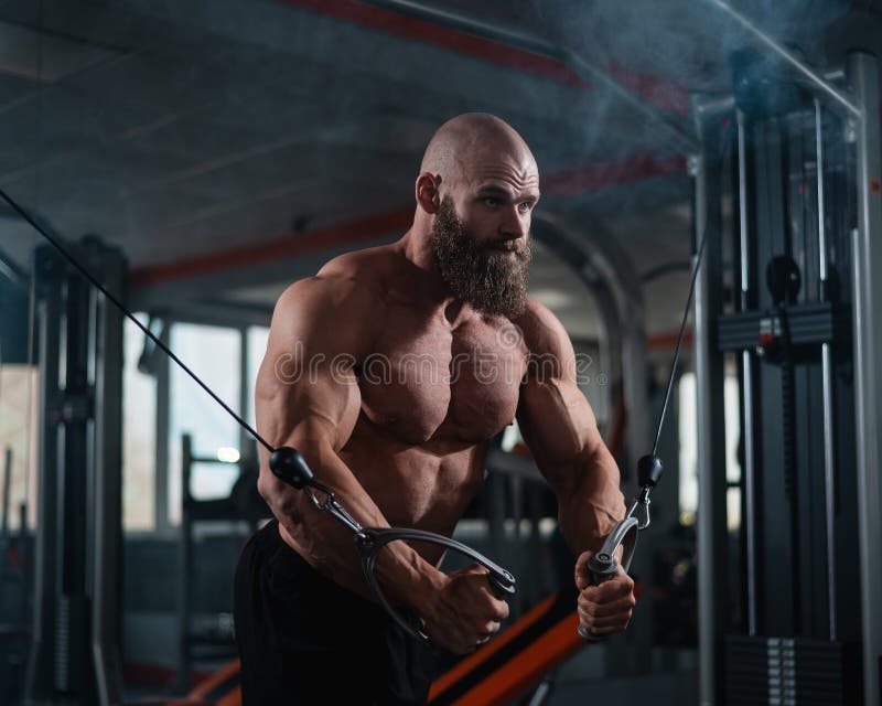 Bald Caucasian Bodybuilder Training Chest Using Cable Crossover in Gym ...