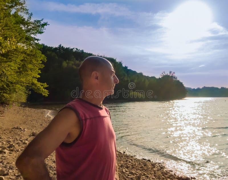 Bald Elderly Man on the Beach Under the Scorching Sun.. Stock Image ...