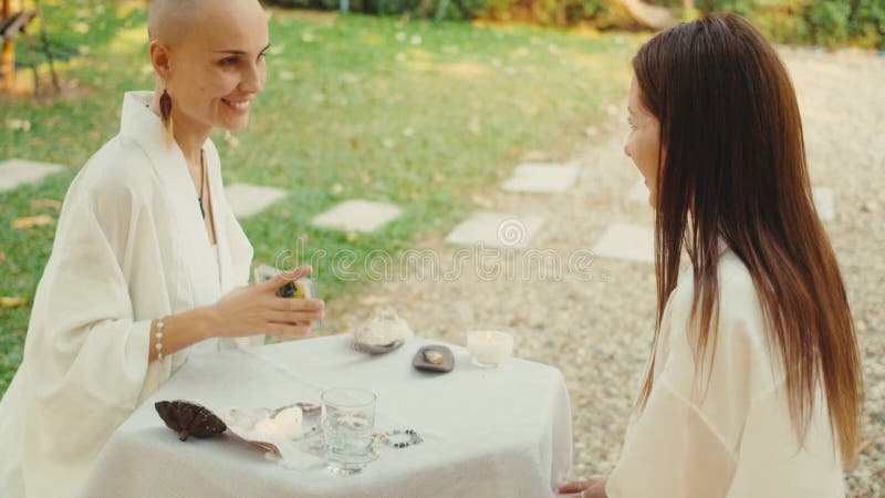 Bald Fortune Teller Reading Tarot Cards, Doing a Reading for a Client ...