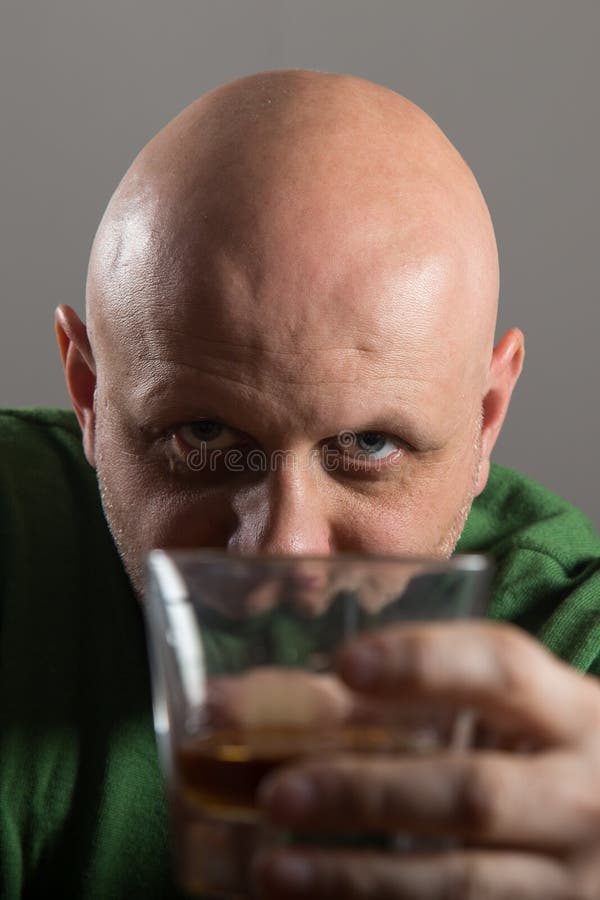 Bald Headed Man Drinking Whiskey Stock Image - Image of closeup, alone ...