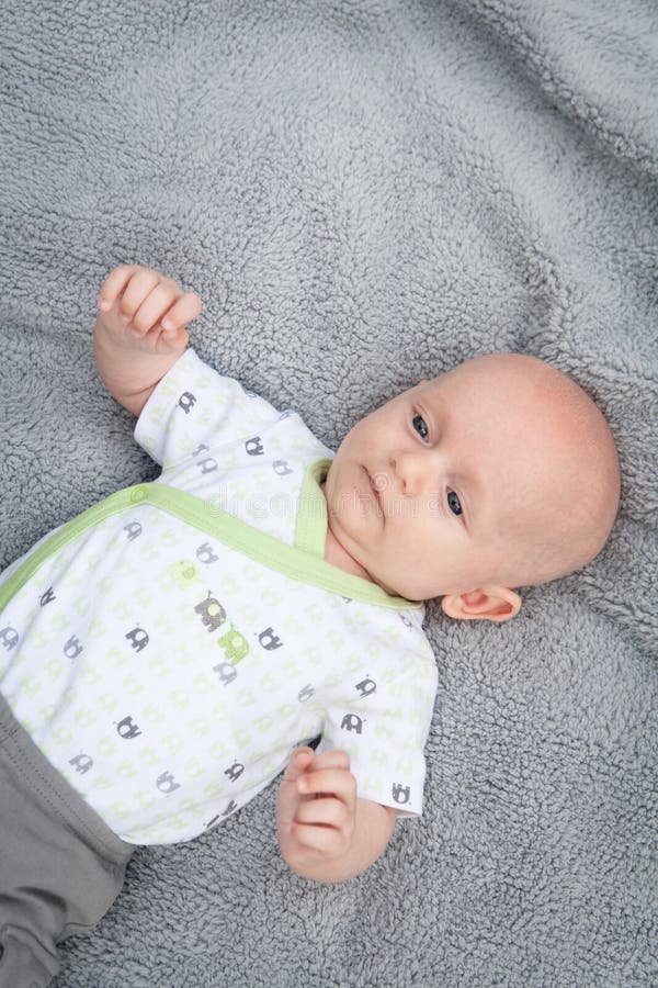 Adorable Bald Baby Boy with Big Blue Eyes Stock Image - Image of hold ...