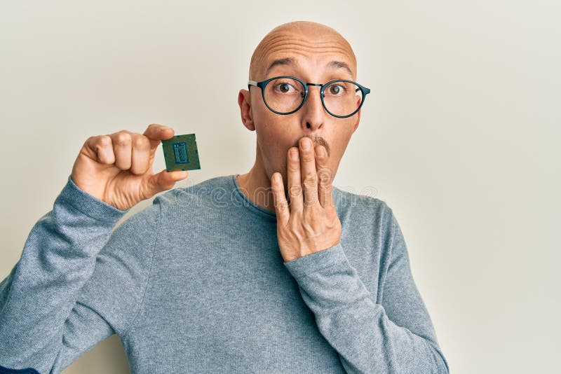 Bald Man with Beard Holding Cpu Computer Processor Covering Mouth with ...