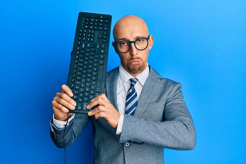 Bald Man with Beard Holding Keyboard Depressed and Worry for Distress ...