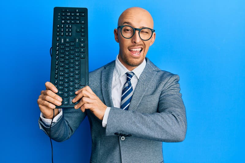 Bald Man with Beard Holding Keyboard Winking Looking at the Camera with ...