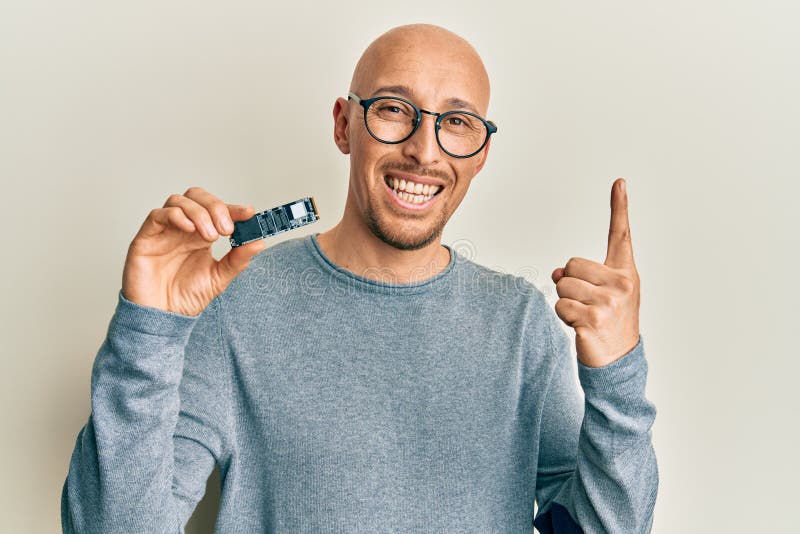 Bald Man with Beard Holding Ssd Memory Smiling with an Idea or Question ...