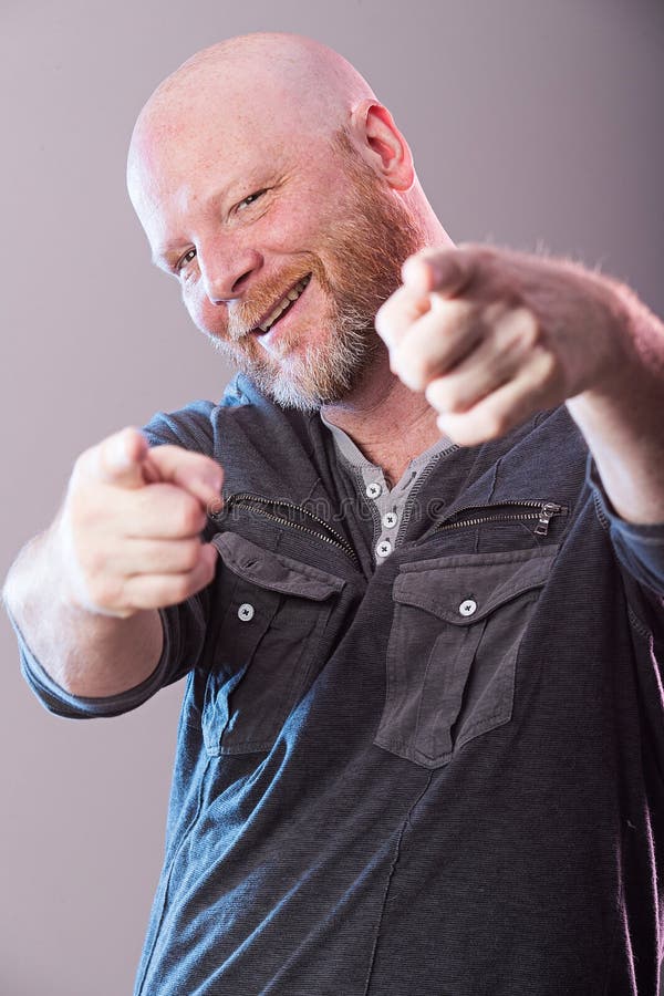 Bald Man Pointing and Grinning Stock Photo - Image of bald, portrait ...