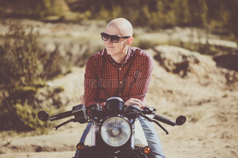 Bald Man with Glasses Sitting on an Old Vintage Motorcycle Stock Photo ...