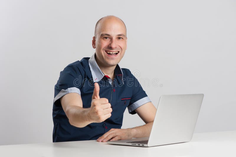 Bald Man with Laptop Showing His Thumb Up Stock Image - Image of ...
