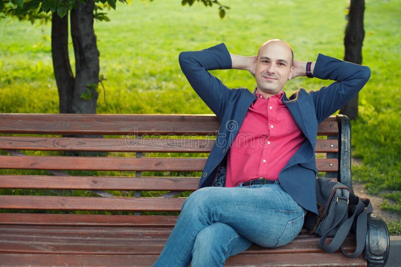 Bald Man Sitting on a Bench in the Park Stock Photo - Image of relax ...