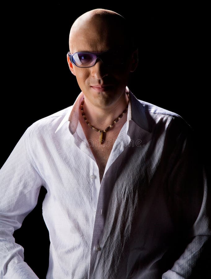 A Bald Man in a Shirt, Lying in Bed and Has a Cold, he Has a Headache ...