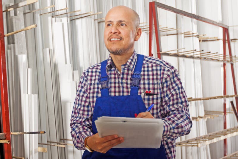 Bald worker in warehouse stock image. Image of staff - 166645387
