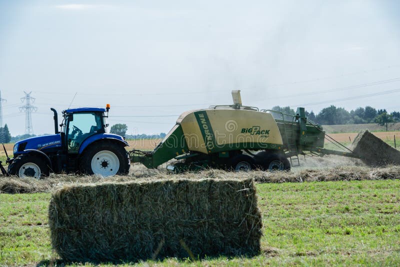 Baler at the haymaking editorial stock image. Image of grain - 123831914